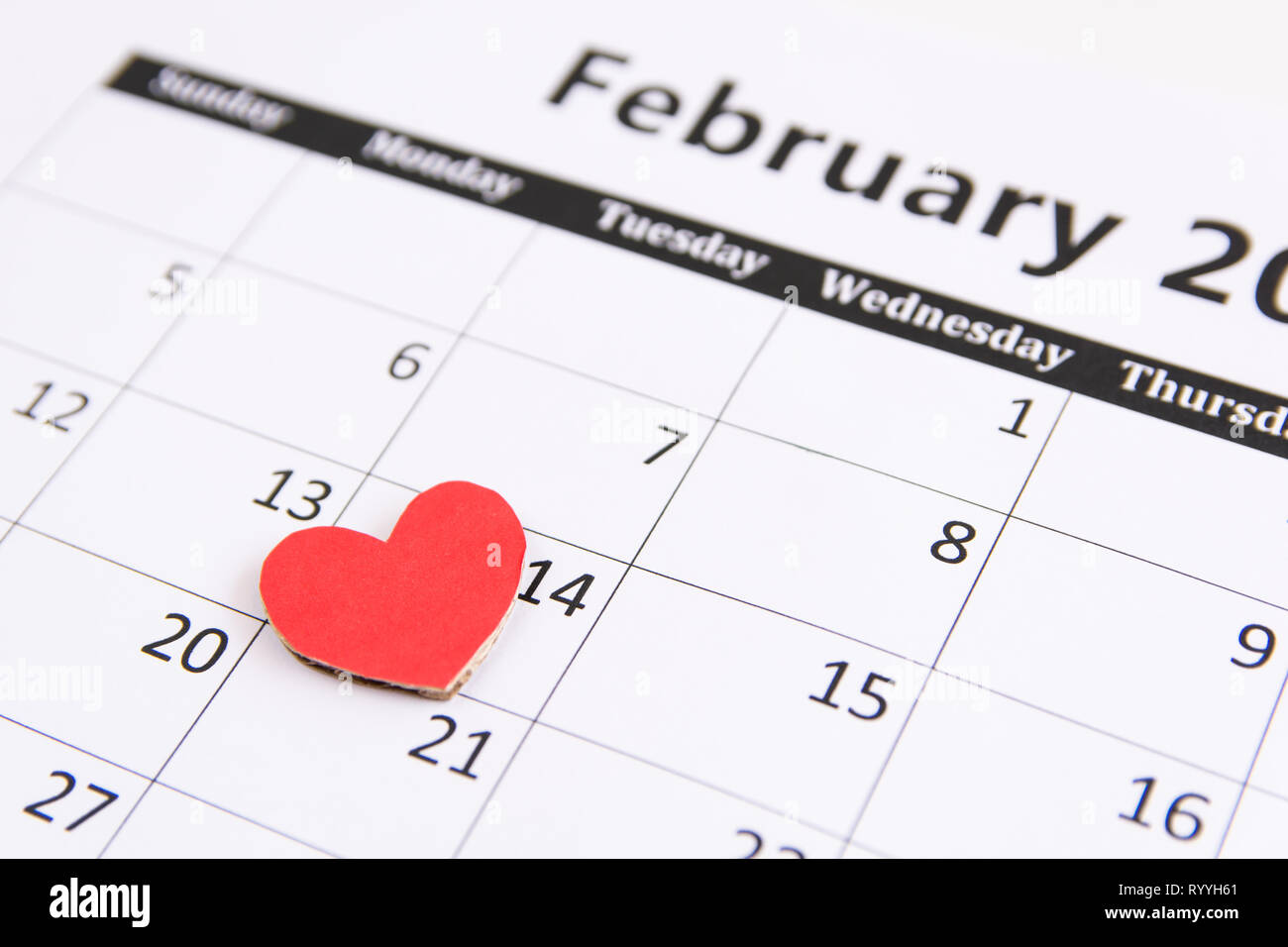 Calendar page and red hearts paper on February 14 of Valentines day ...