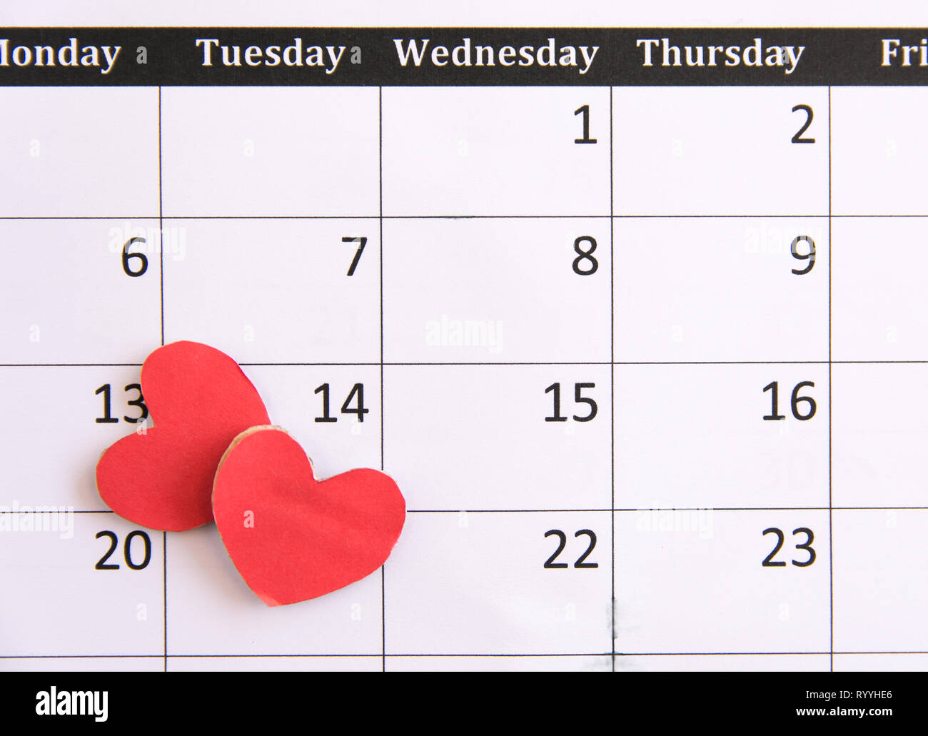 Calendar page and red hearts paper on February 14 of Valentines day ...