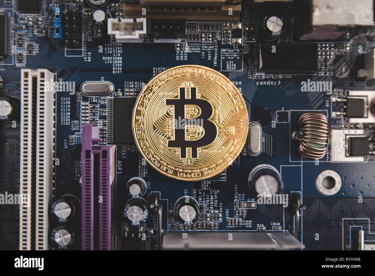 Golden Bitcoin coins on Motherboard, miner with circuit board, pool ...