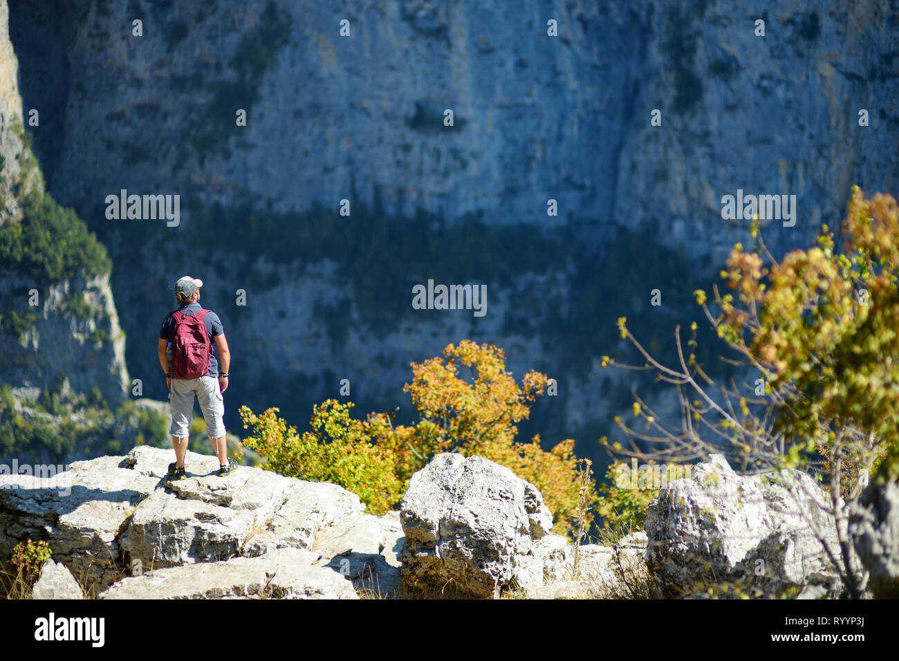 Young male tourist exploring Vikos Gorge in the Pindus Mountains of ...