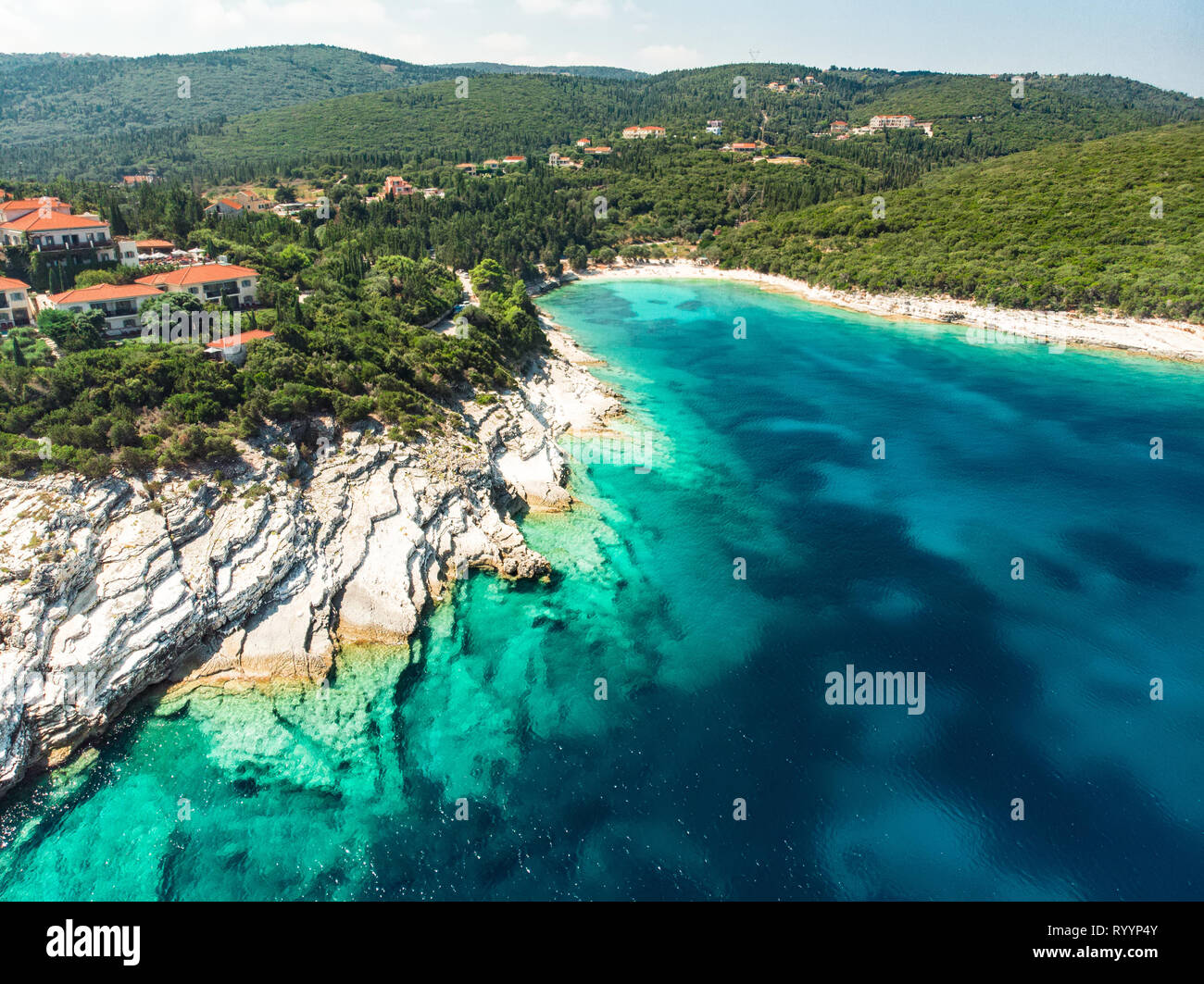 Aerial view of Emplisi Beach, picturesque stony beach in a secluded bay ...
