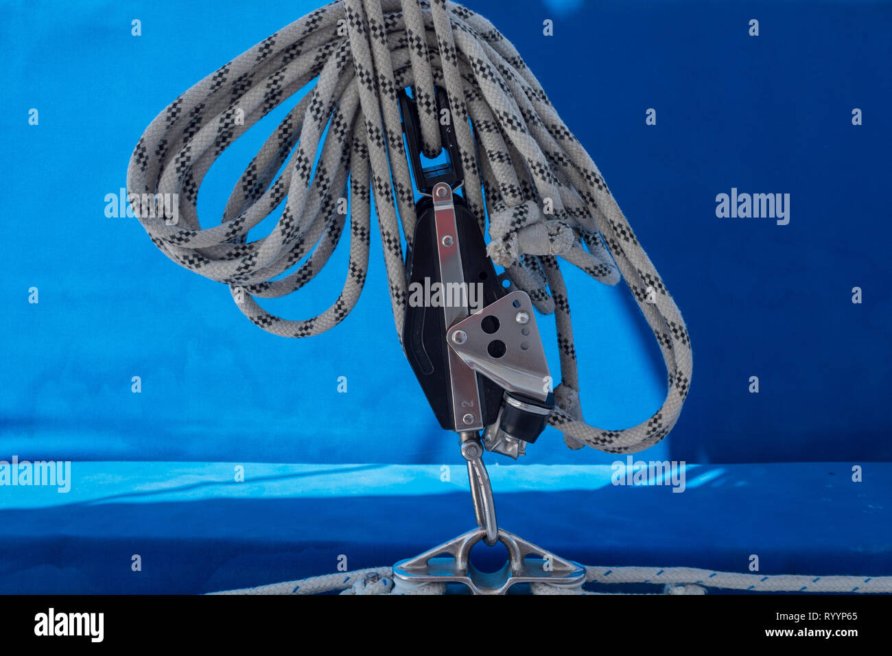 closeup on sailing rope. detail shot on coiled rope ready to set sail ...