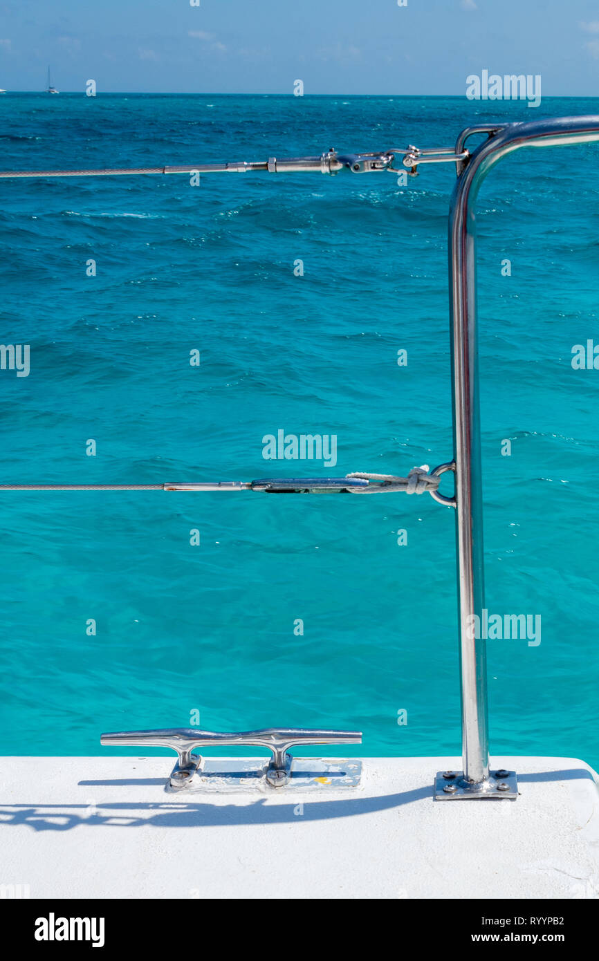 sailboat handrail in the caribbean. metal handrail against crystal ...