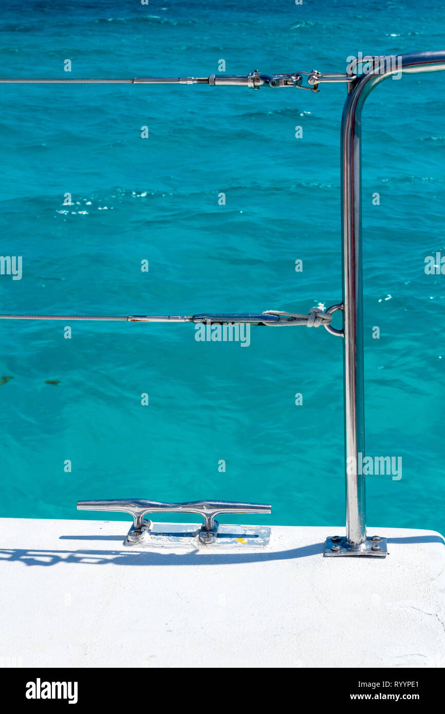 sailboat handrail in the caribbean. metal handrail against crystal ...