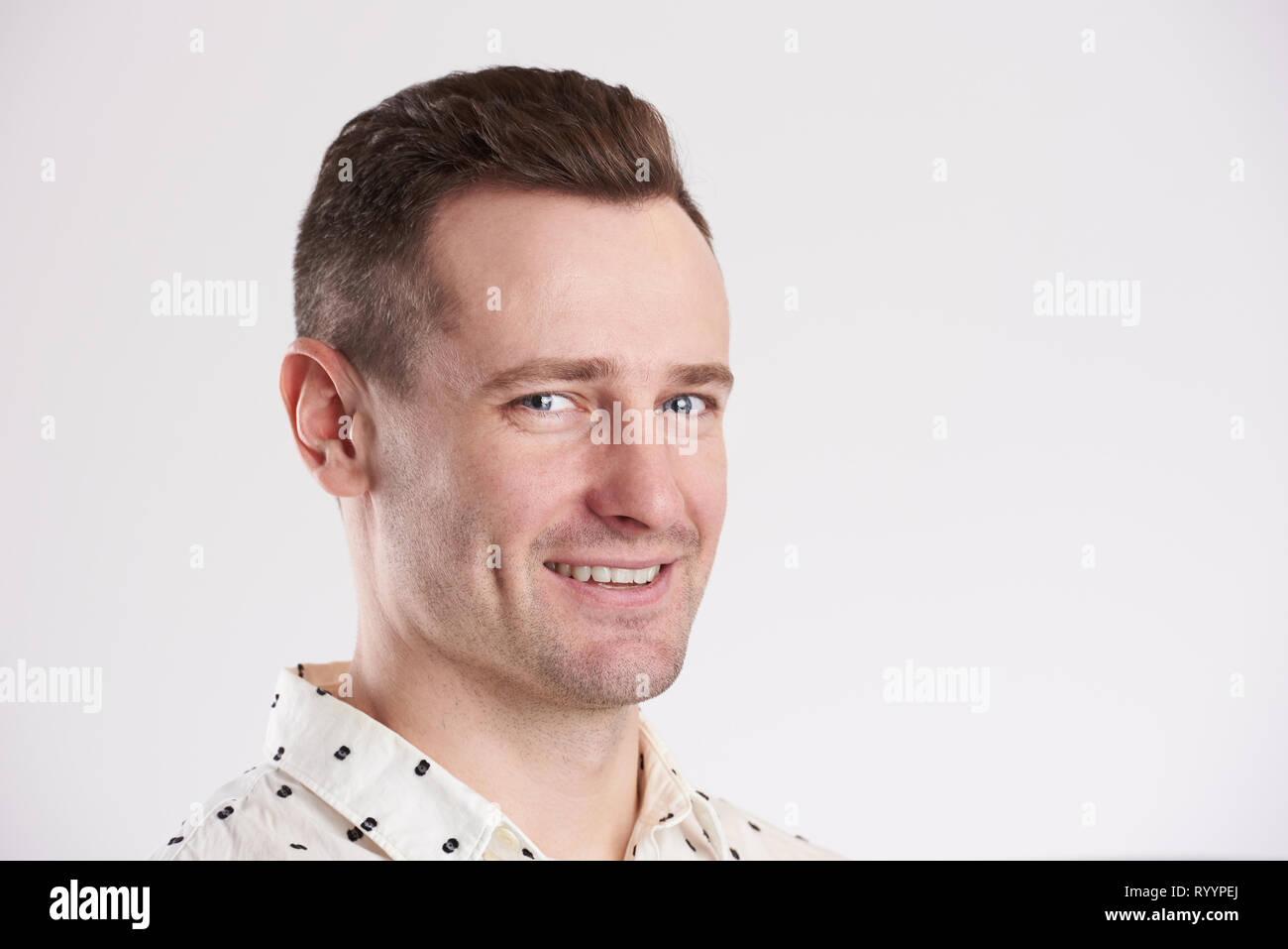 Smiling with teeth young man portrait isolated on white background ...
