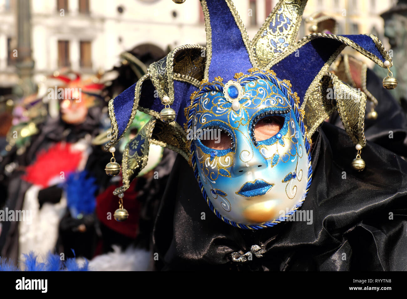 People dressed in traditional mask and costume for Venice Carnival ...