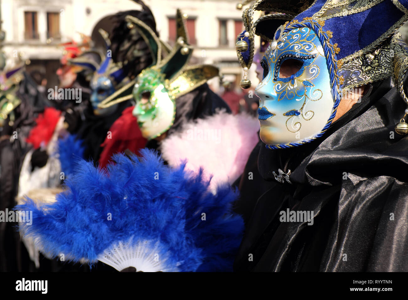 People dressed in traditional mask and costume for Venice Carnival ...
