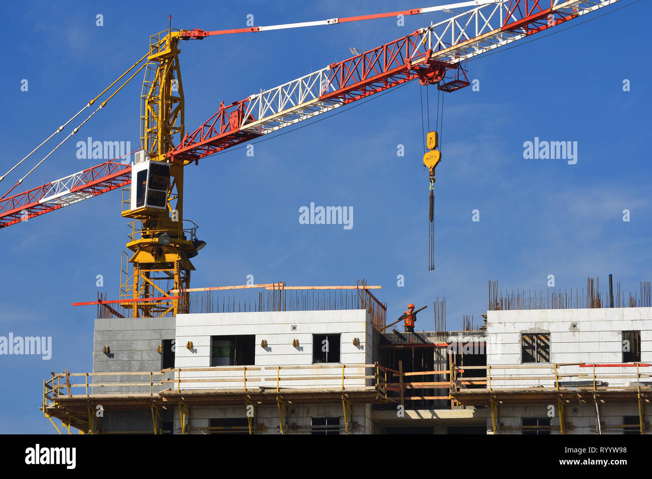 Working construction site with the high crane and the constructed ...