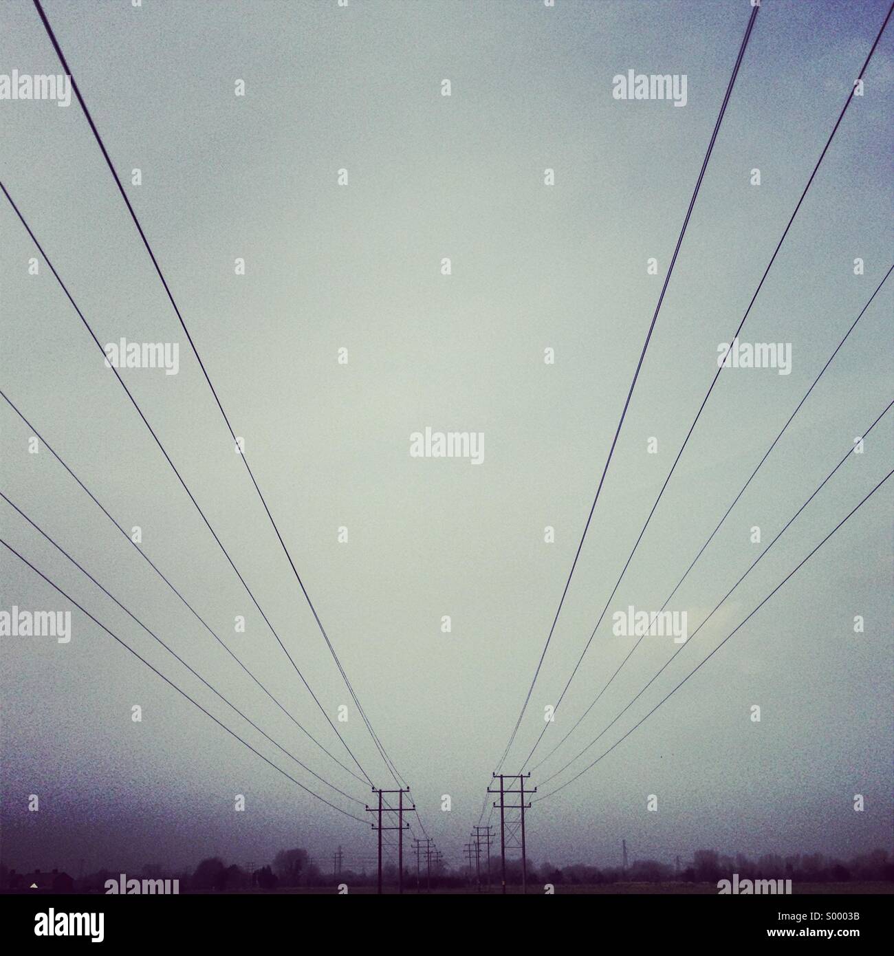 Power lines on a grey day Stock Photo - Alamy