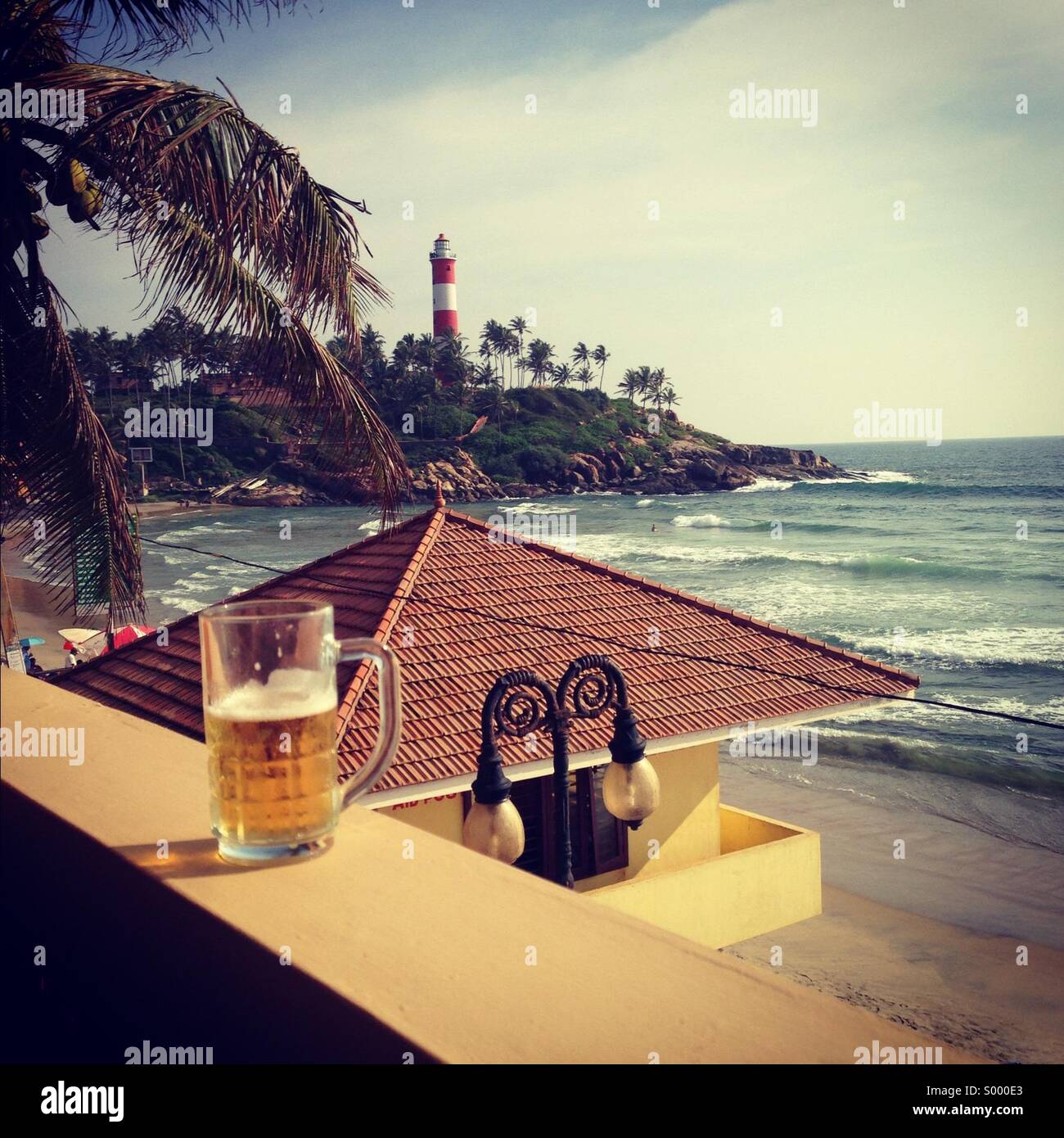 A beer overlooking the lighthouse beach, kovalum, Kerala, India Stock ...