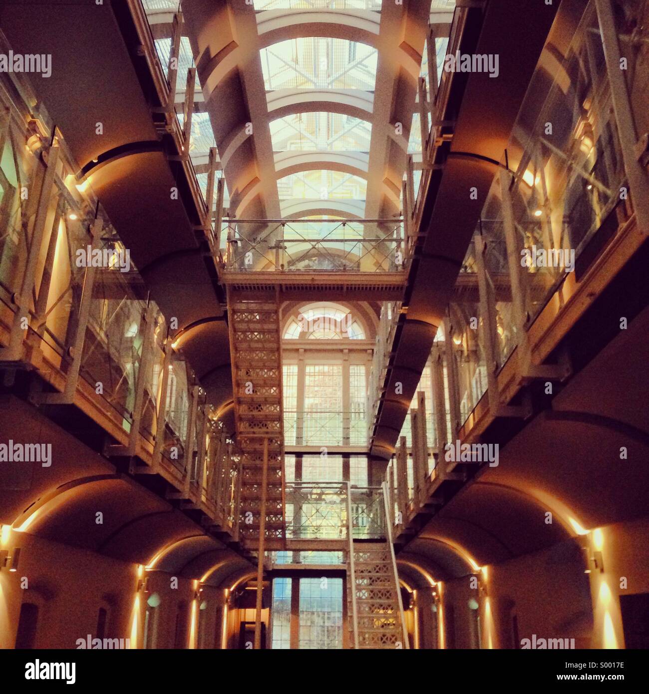 Interior of a refurbished and repurposed old prison Stock Photo - Alamy