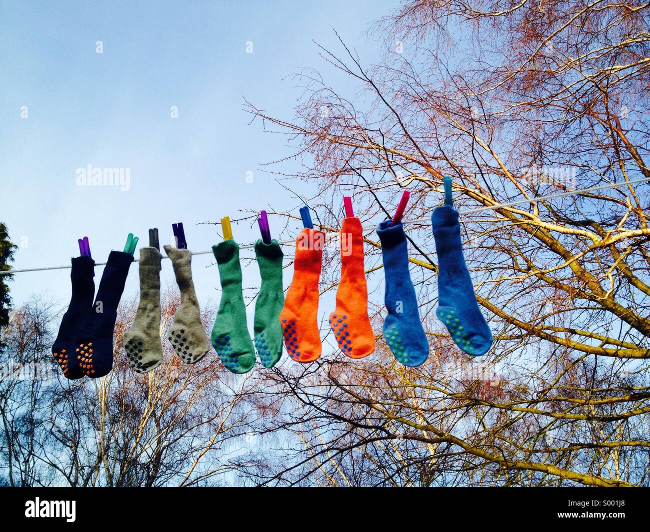 Laundry drying socks hi-res stock photography and images - Alamy