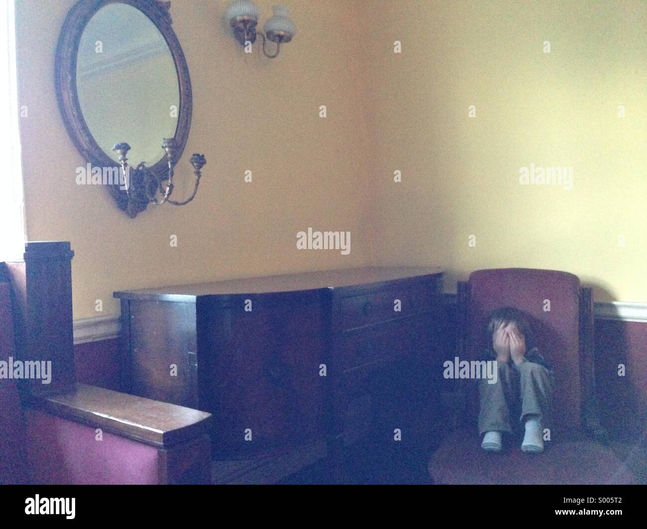 Scared child hiding hi-res stock photography and images - Alamy