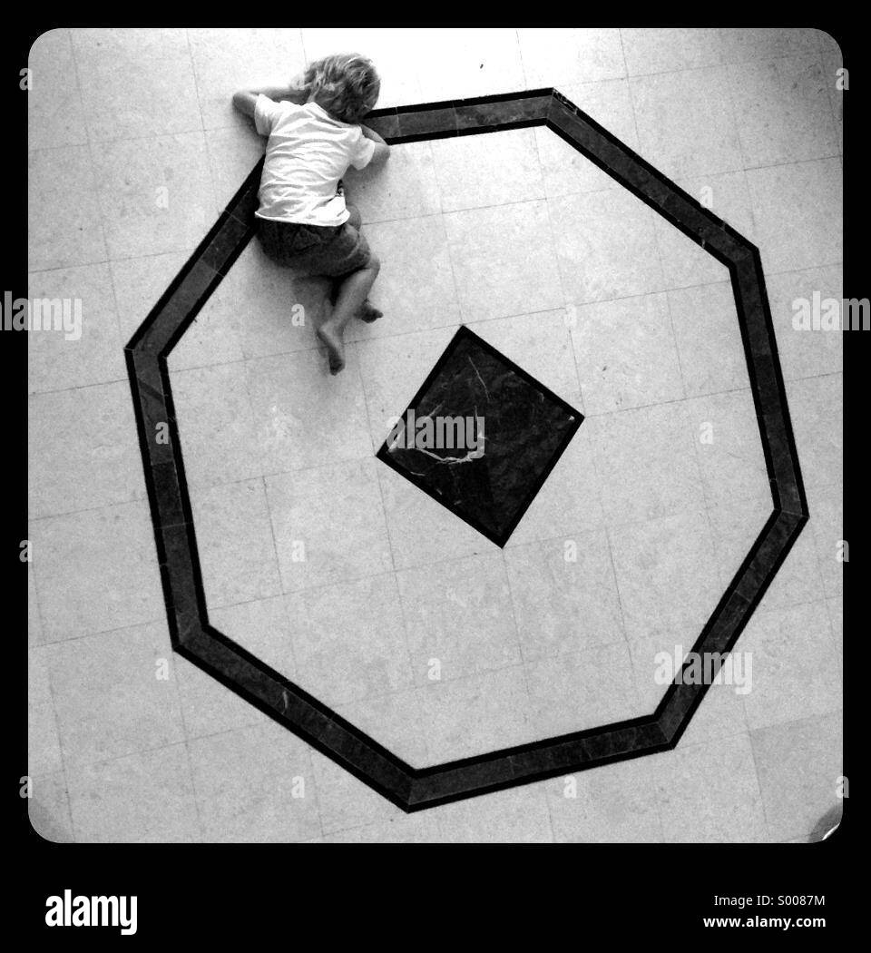 Child sleep floor Black and White Stock Photos & Images - Alamy
