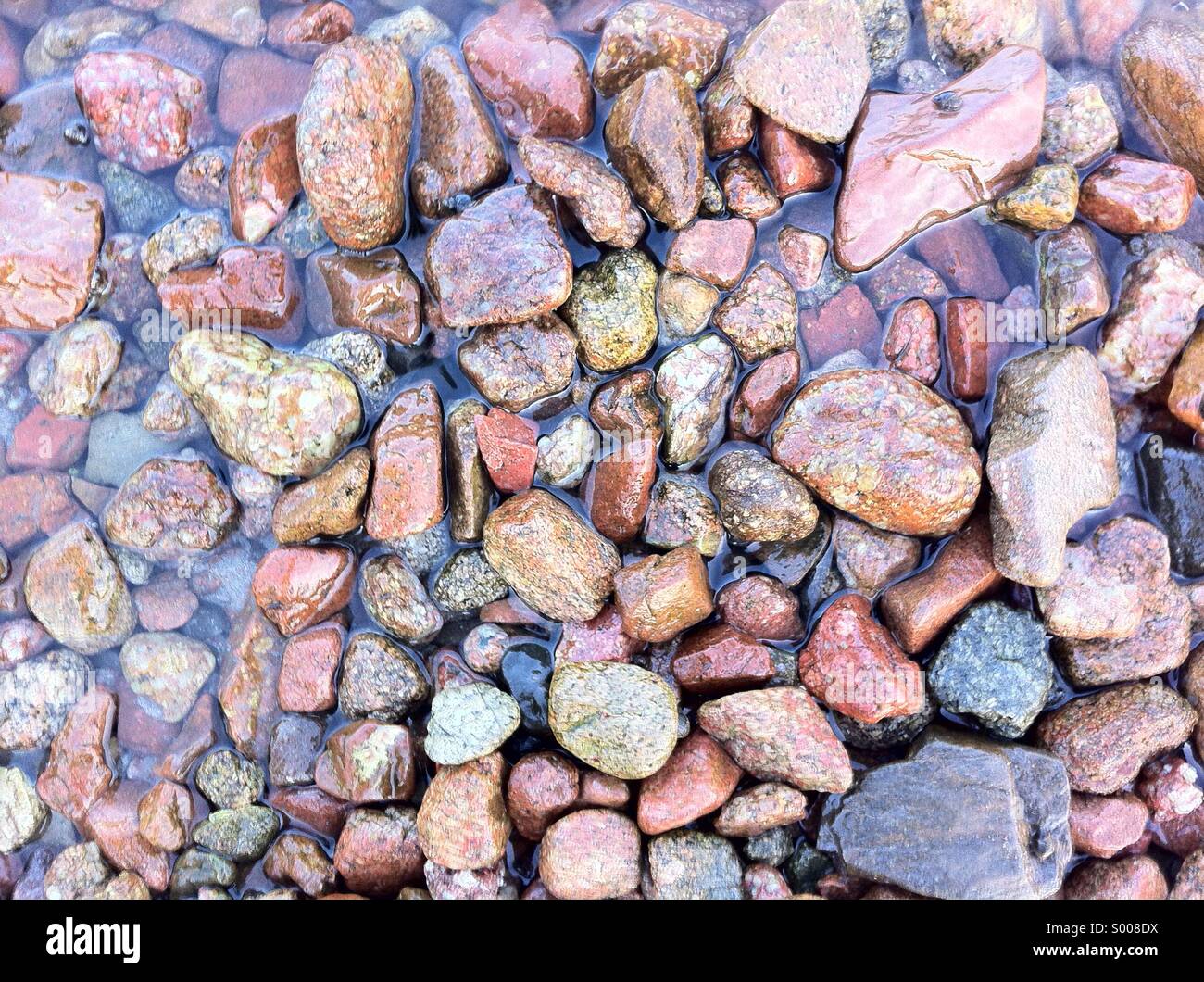 Wet stones on the beach hi-res stock photography and images - Alamy