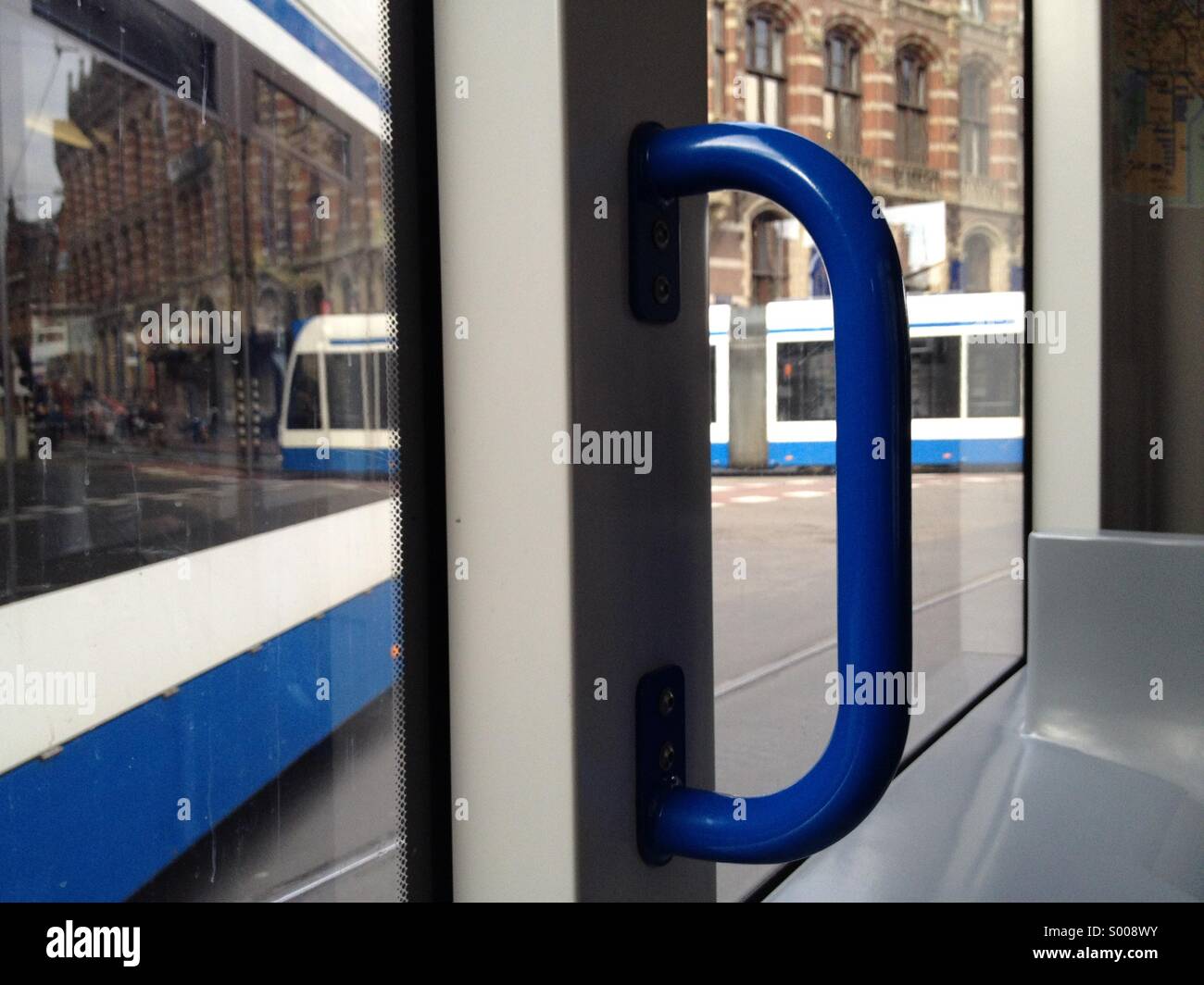 Three trams passing in Amsterdam Stock Photo - Alamy