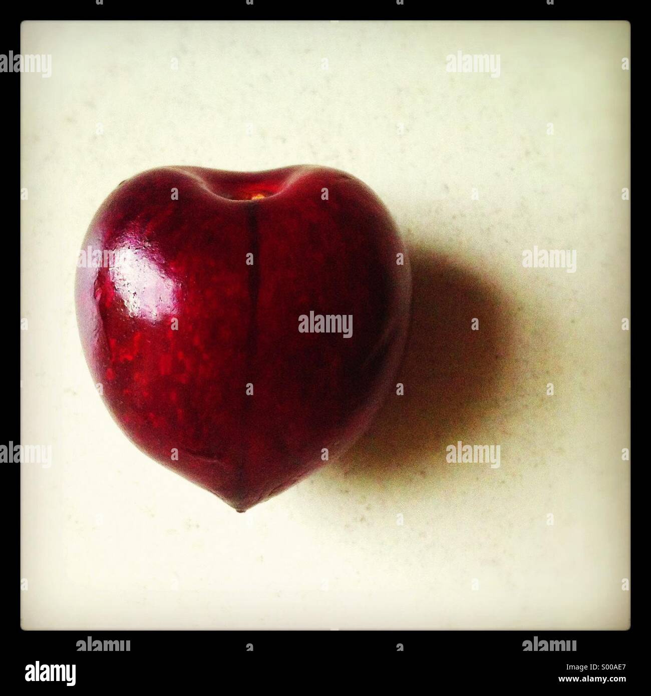 Heart shaped cherry Stock Photo - Alamy