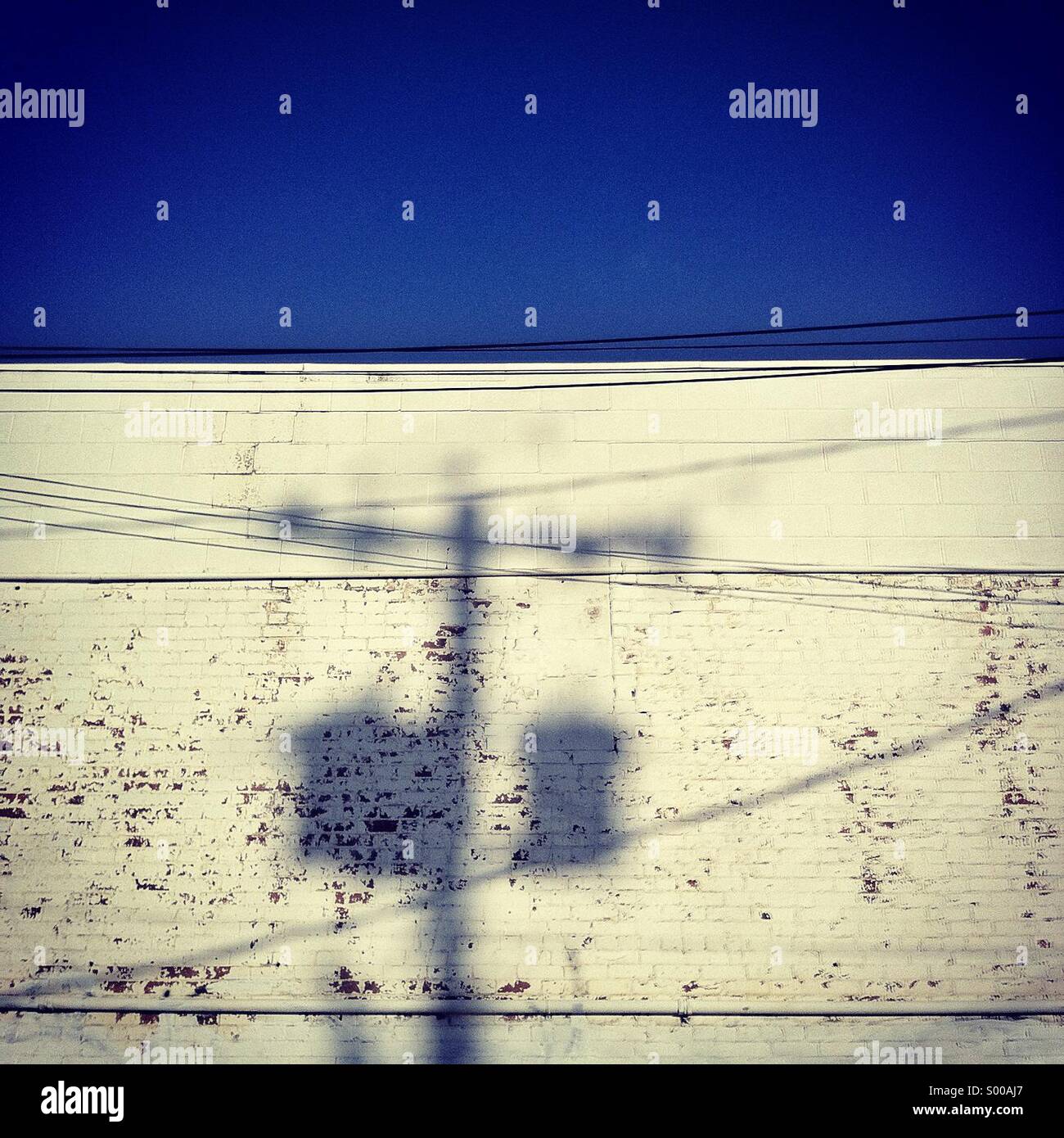Shadow of power lines on white wall Stock Photo - Alamy