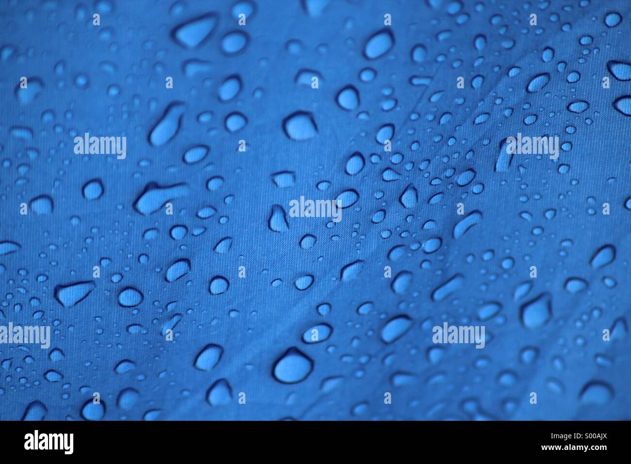Water droplets flowing Stock Photo - Alamy