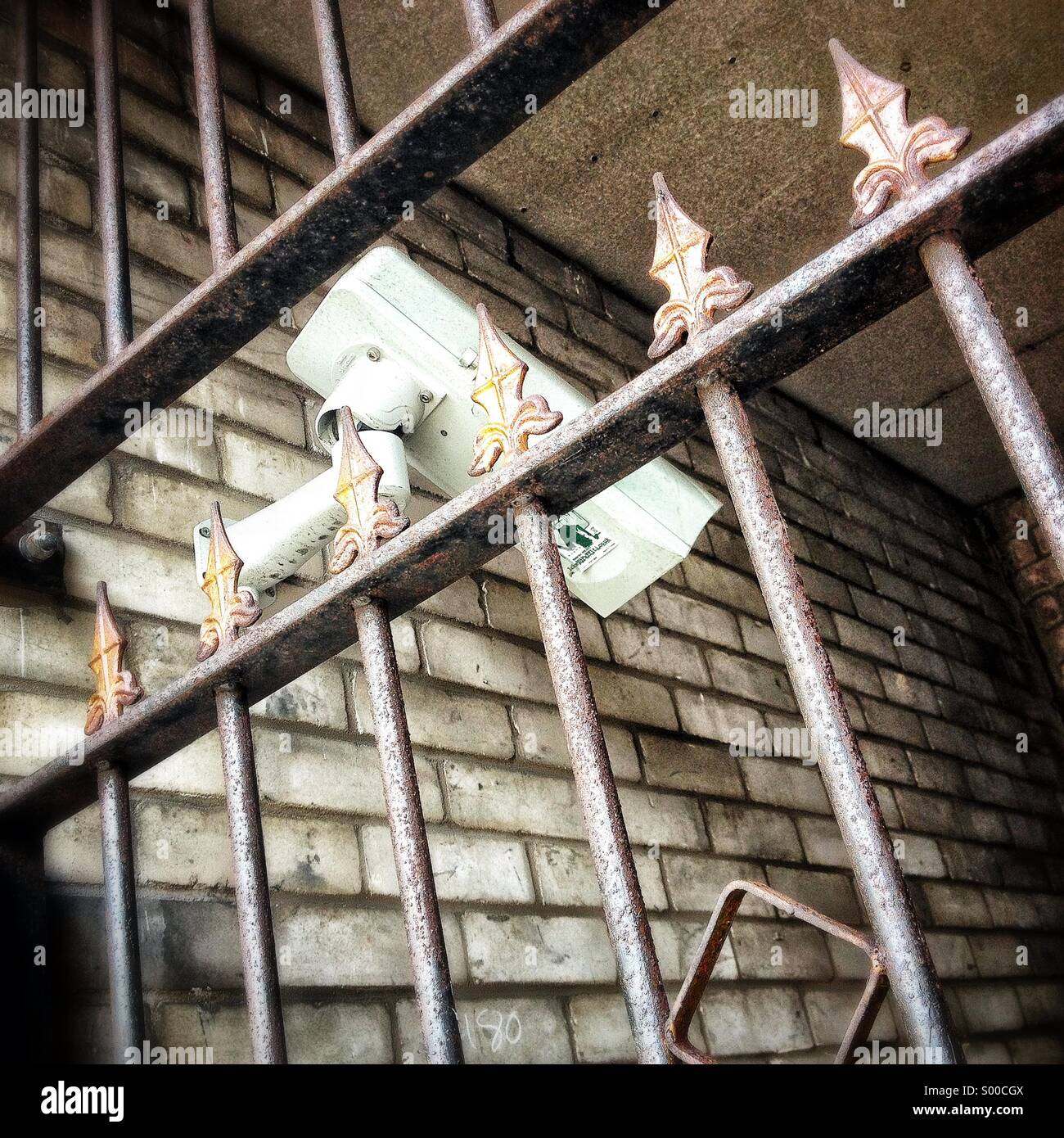 CCTV camera behind gates, bristol, UK Stock Photo - Alamy