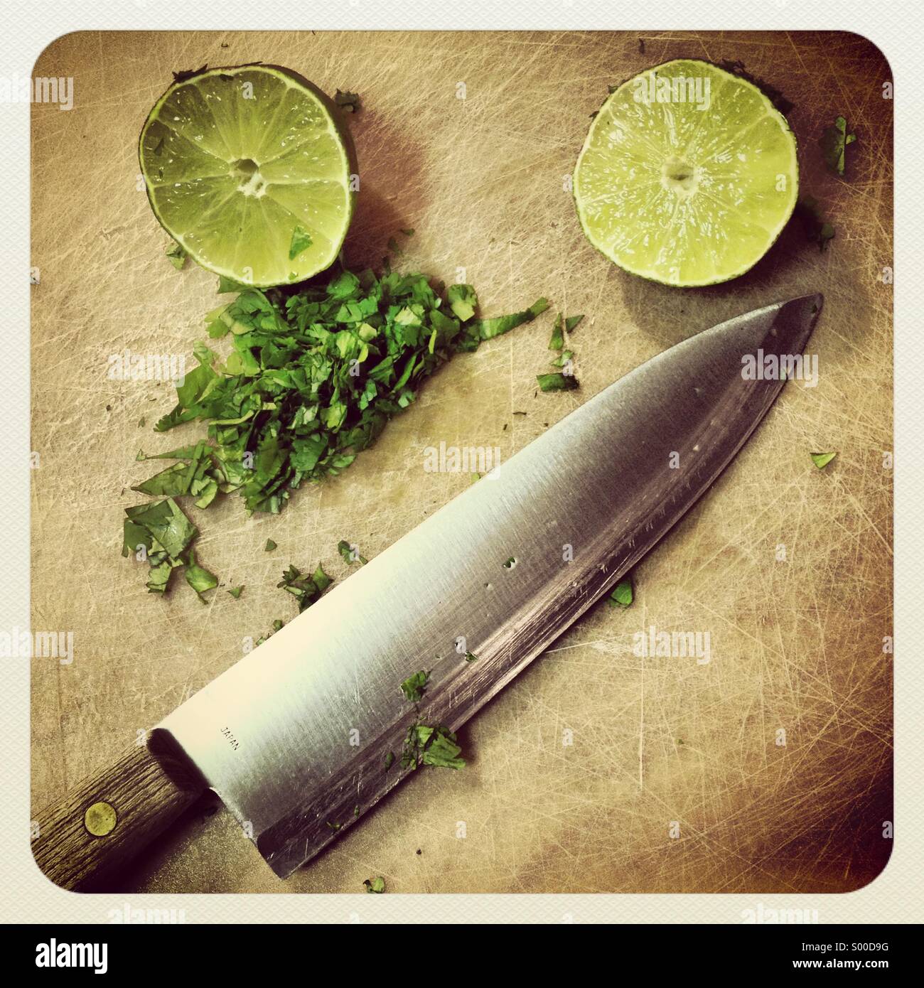 Lime, cilantro and knife Stock Photo - Alamy
