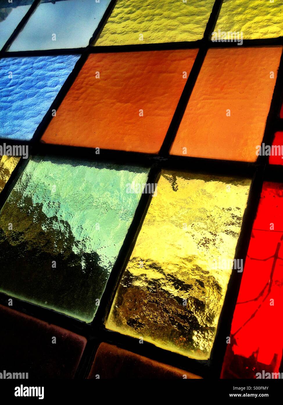 Multi coloured stained glass window Stock Photo - Alamy