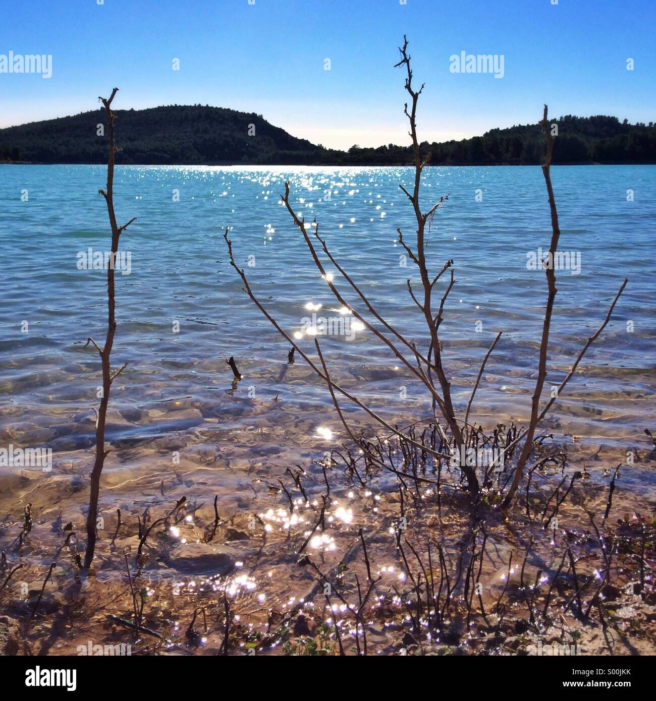 The reflection of the sun over the water Stock Photo - Alamy