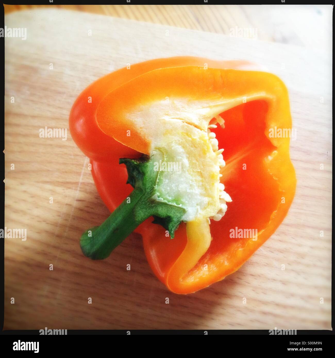 Food - orange bell pepper cut in half Stock Photo - Alamy