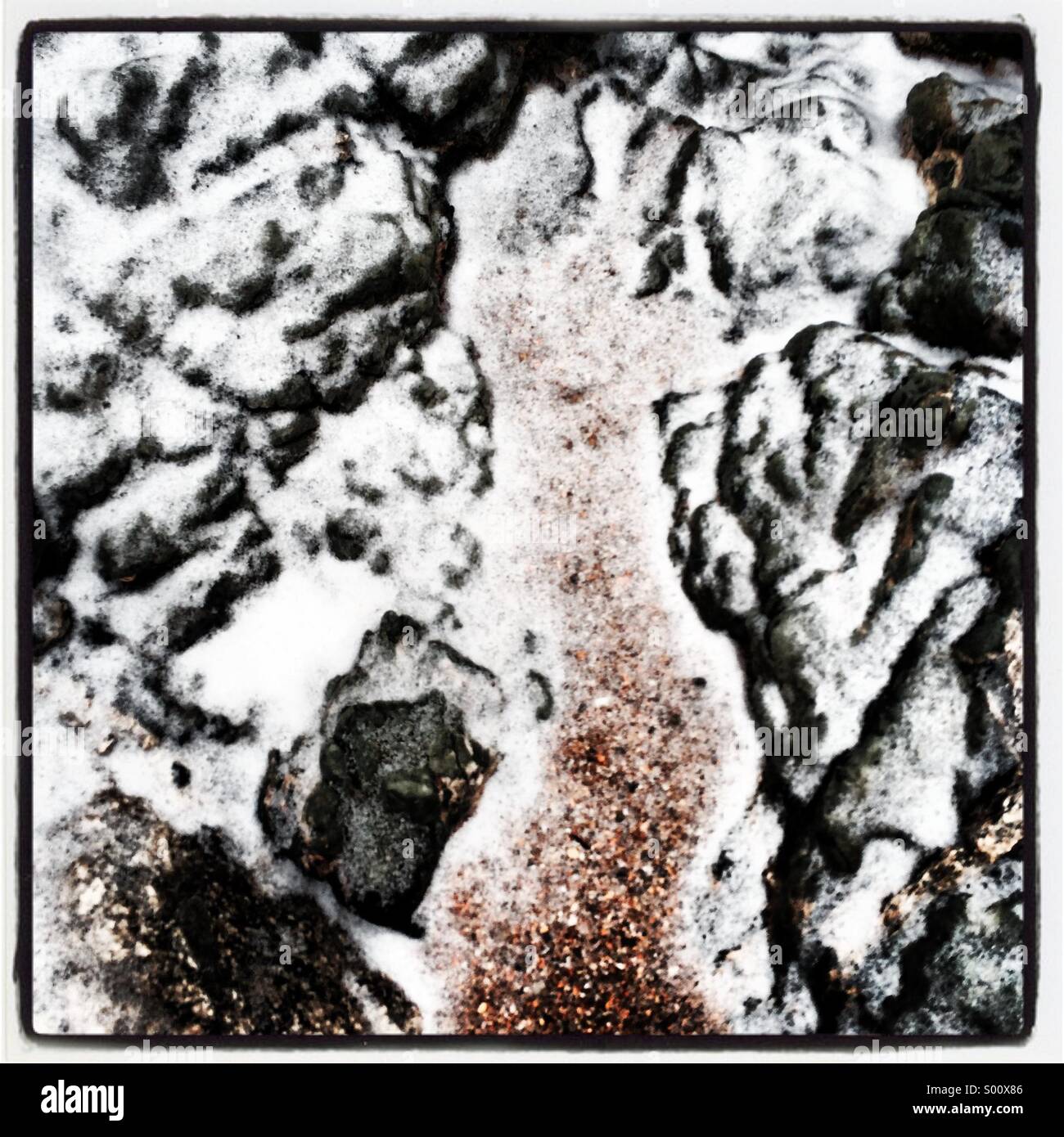 Ice, snow sand and stone on beach Stock Photo - Alamy