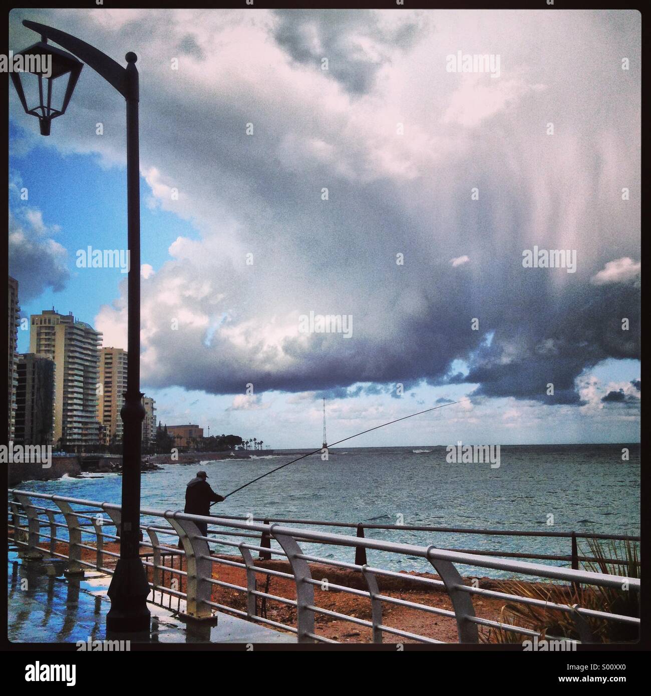 Fisherman fishing in winter at Beirut coastal shore - Lebanon Middle ...