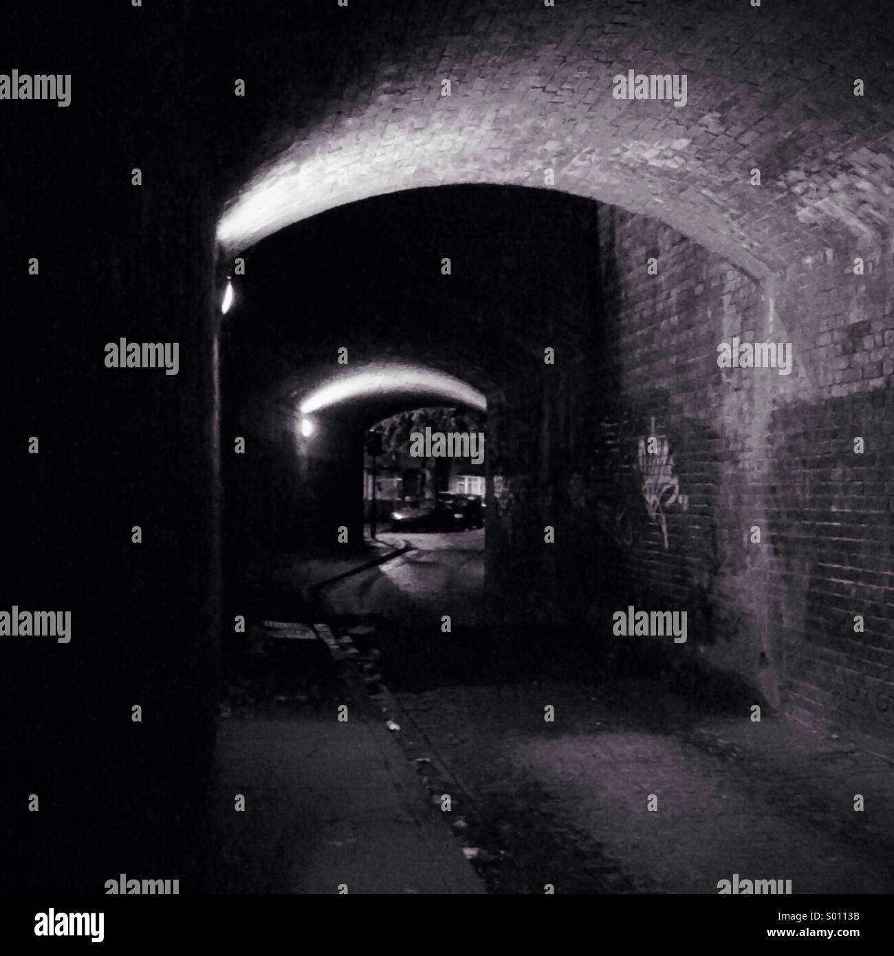 View through Creepy, Dark Tunnel at Night Stock Photo - Alamy
