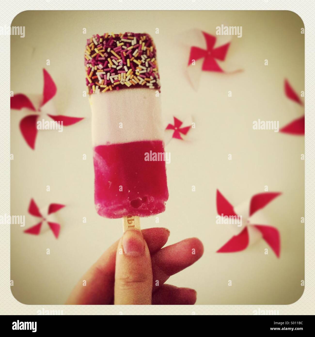 Ice lolly and pinwheels Stock Photo - Alamy