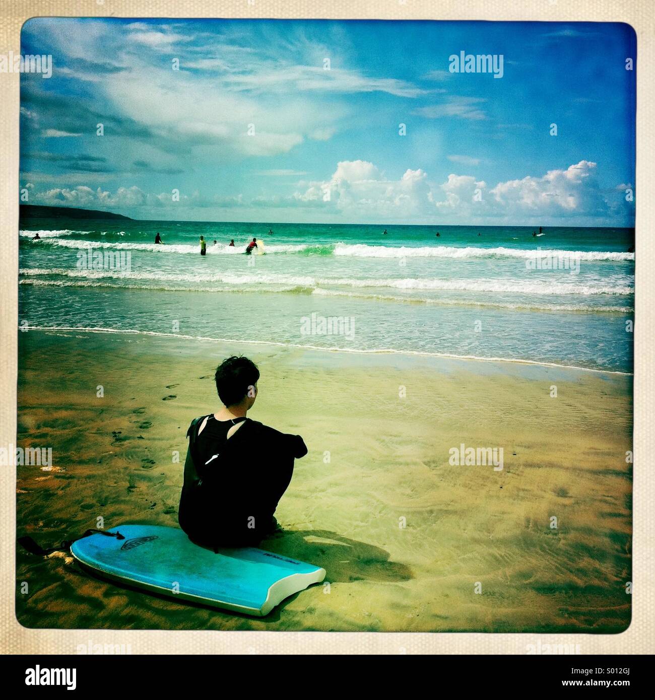Boy standing sea watching waves hi-res stock photography and images - Alamy