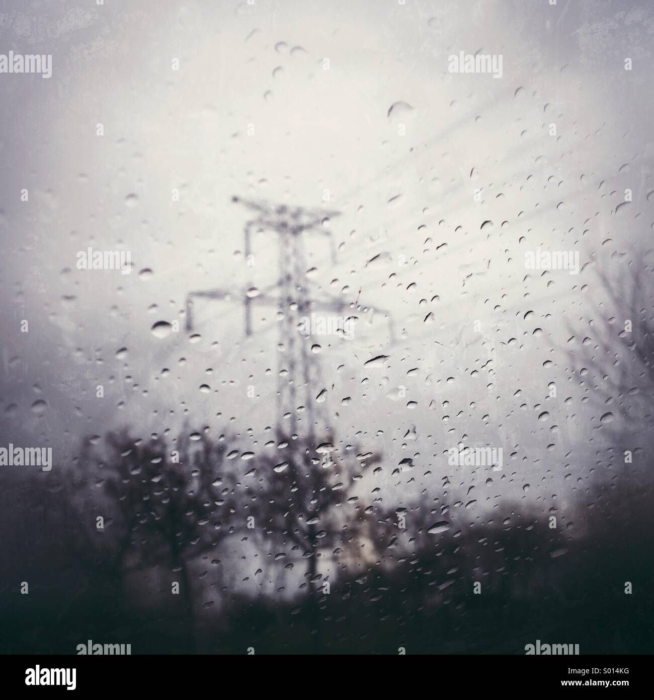 Electric tower through the window on a rainy day Stock Photo - Alamy