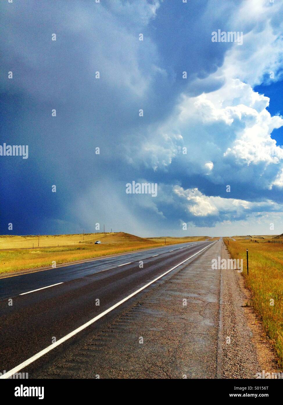 Asphalt road dark thunder clouds hi-res stock photography and images ...