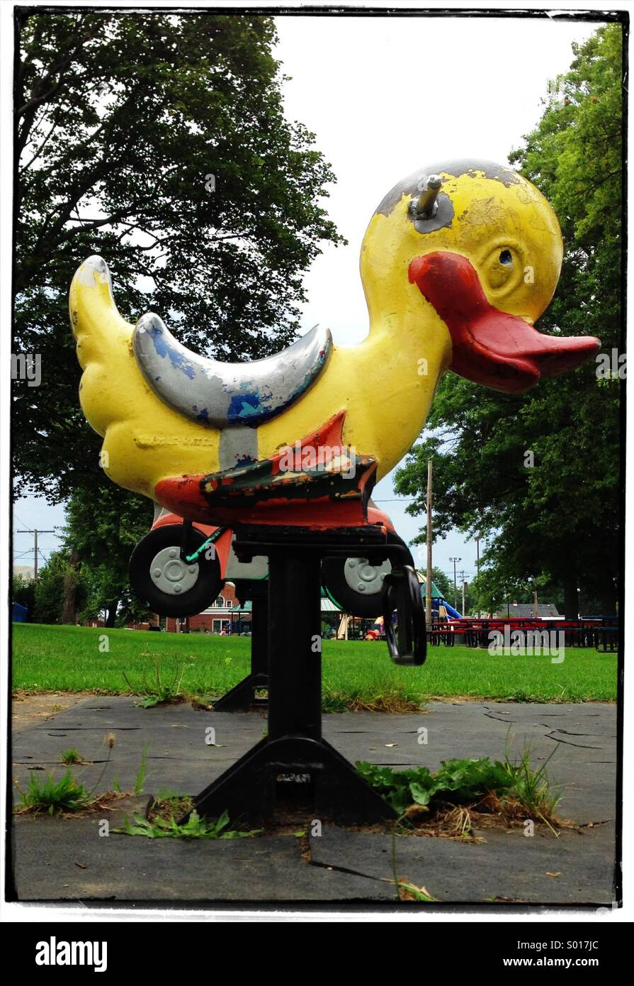 Old rusty duck ride at playground Stock Photo - Alamy