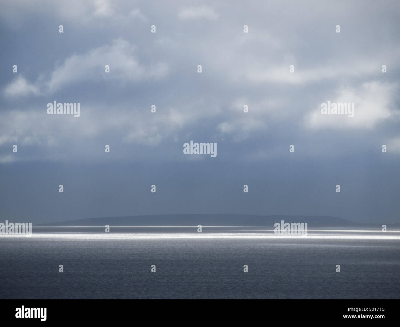Grey seascape, sun on the water Stock Photo - Alamy