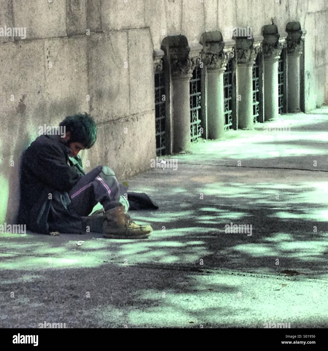 A person living in the street sleeps in a street of Colonia Roma ...