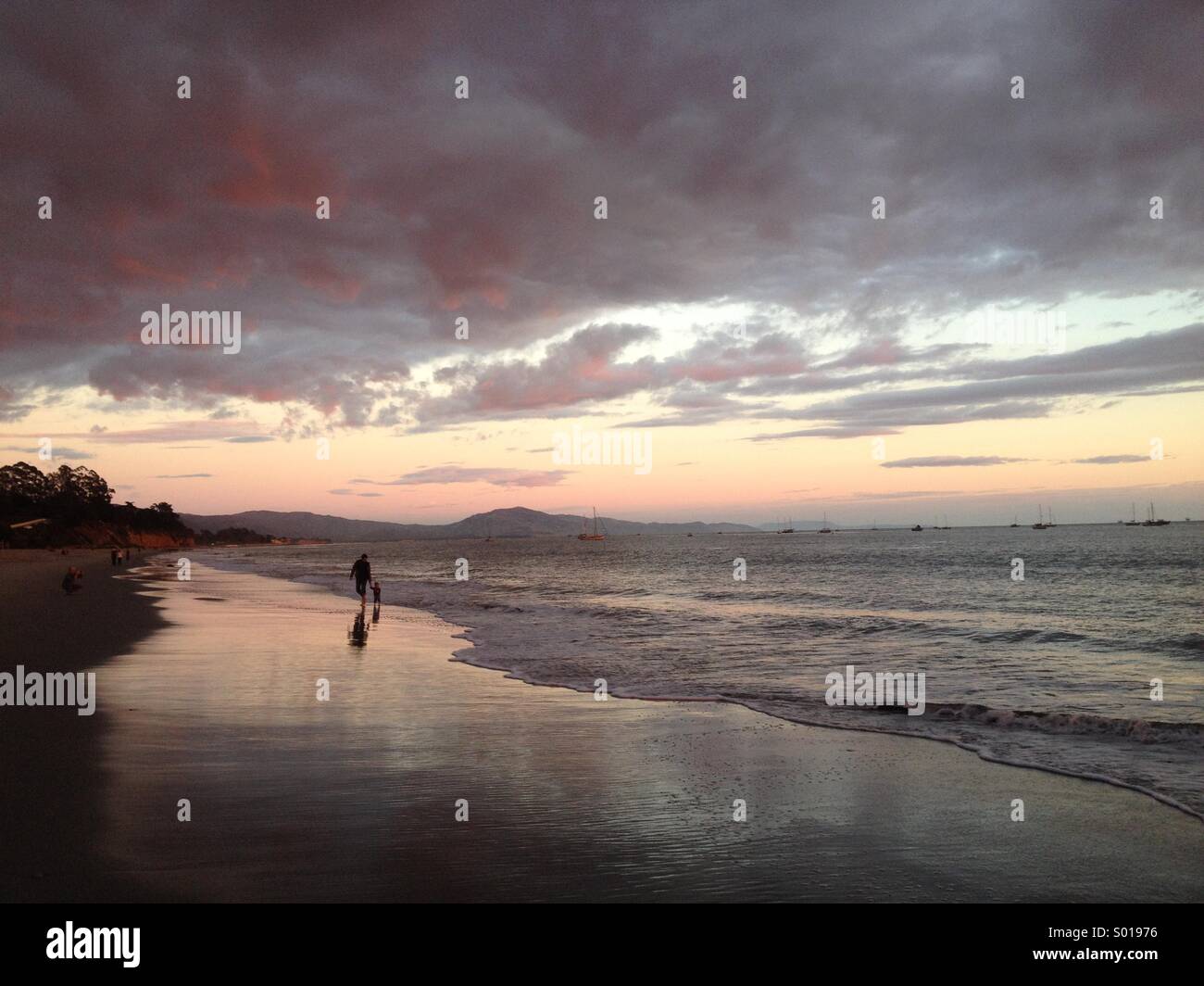 Father and son on beach at sunset Stock Photo - Alamy