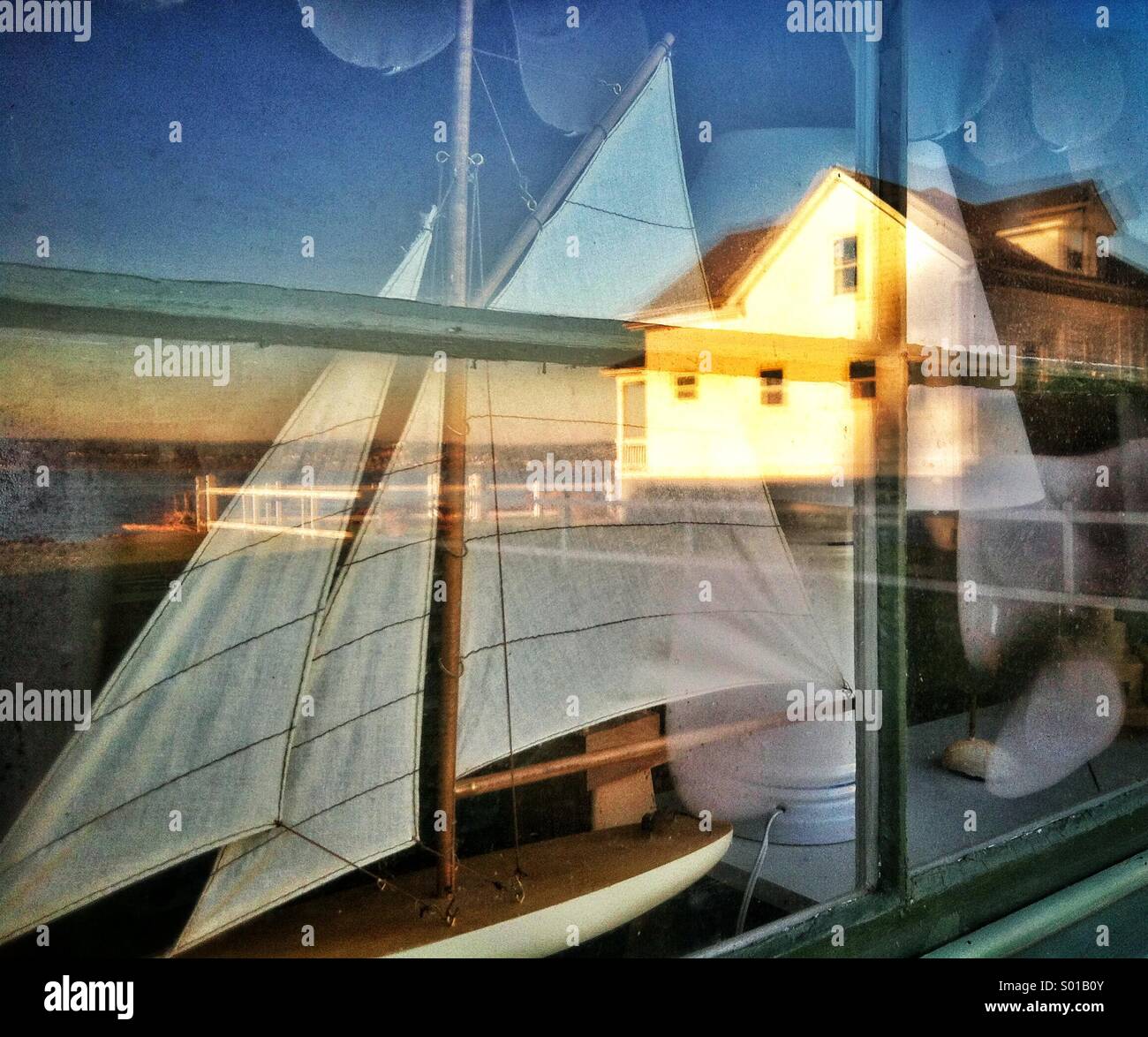Sailboat in a window Stock Photo - Alamy