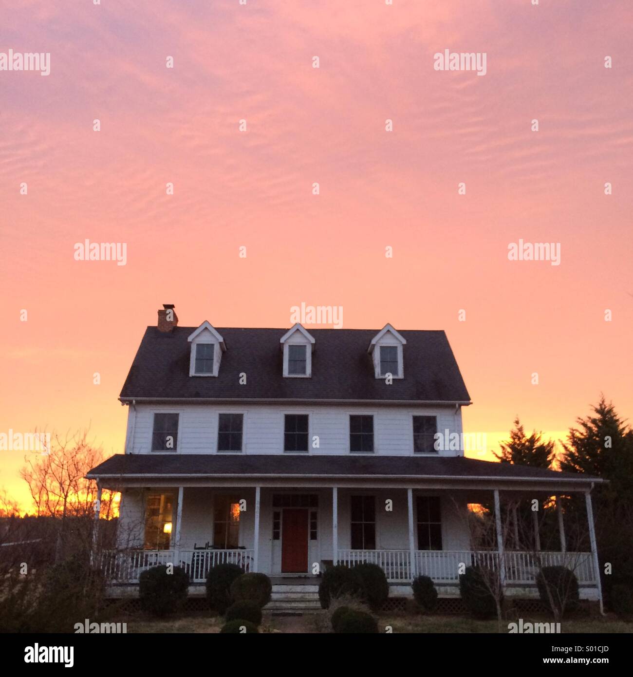 Farm house at sunset Stock Photo - Alamy