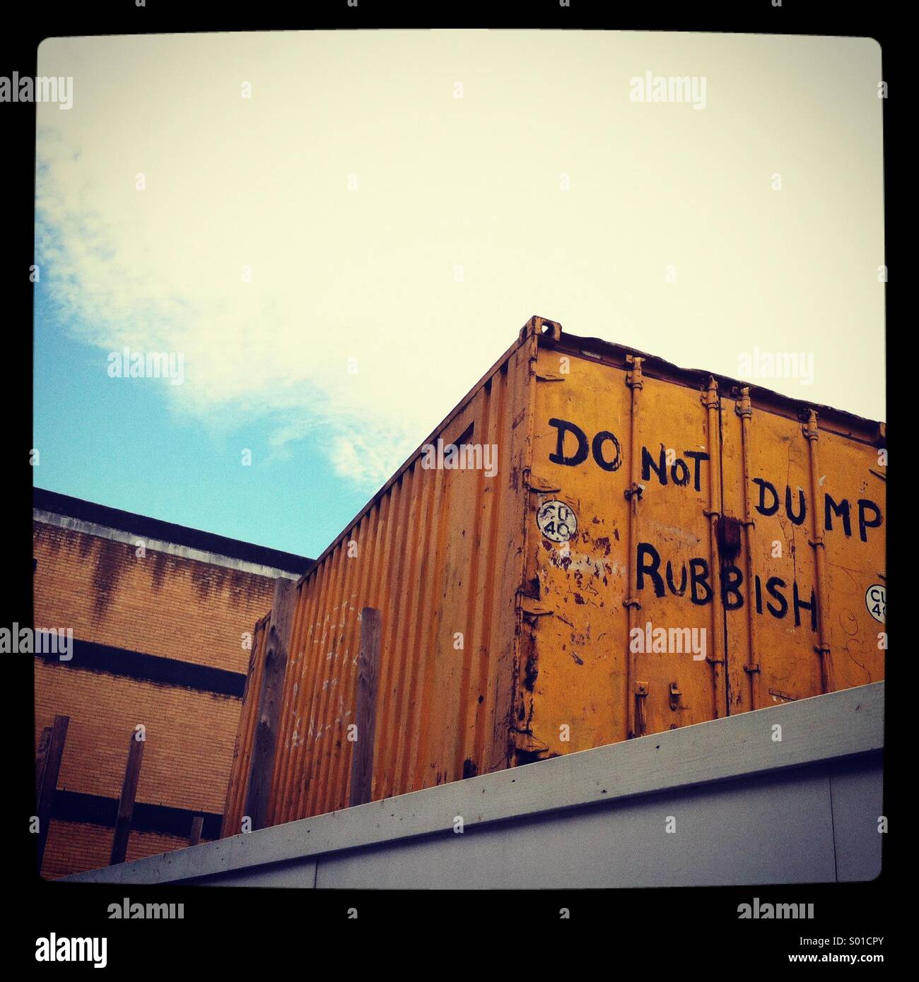 'Do not dump rubbish' writing on a container Stock Photo - Alamy