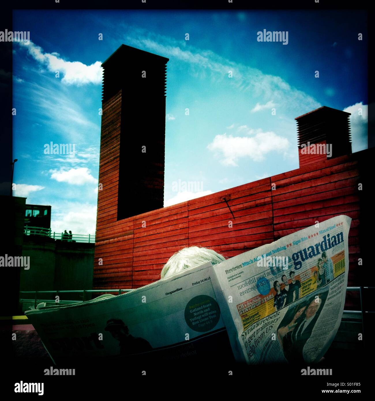 Guardian newspaper reader at National Theatre, London Stock Photo - Alamy