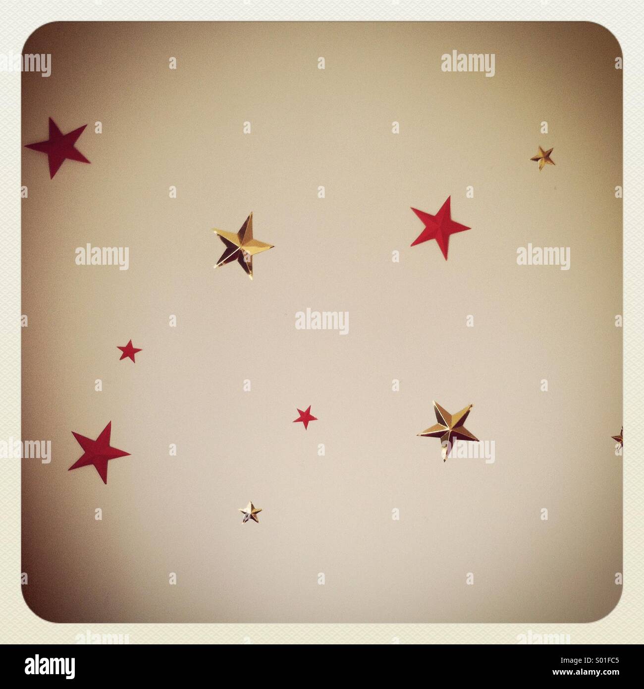 Red and gold stars on a wall Stock Photo - Alamy