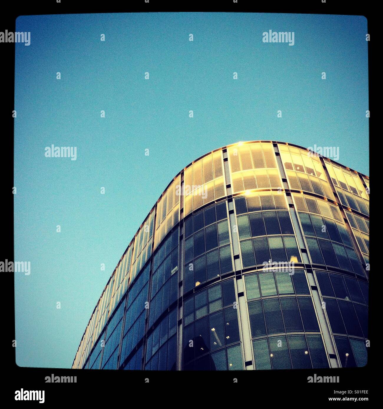 Sunlight illuminating the top of a building in the city, London Stock ...