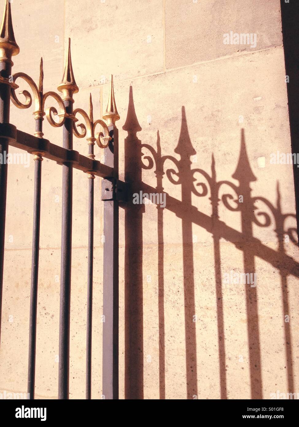 Gate with shadow, Louvre, Paris, France Stock Photo - Alamy