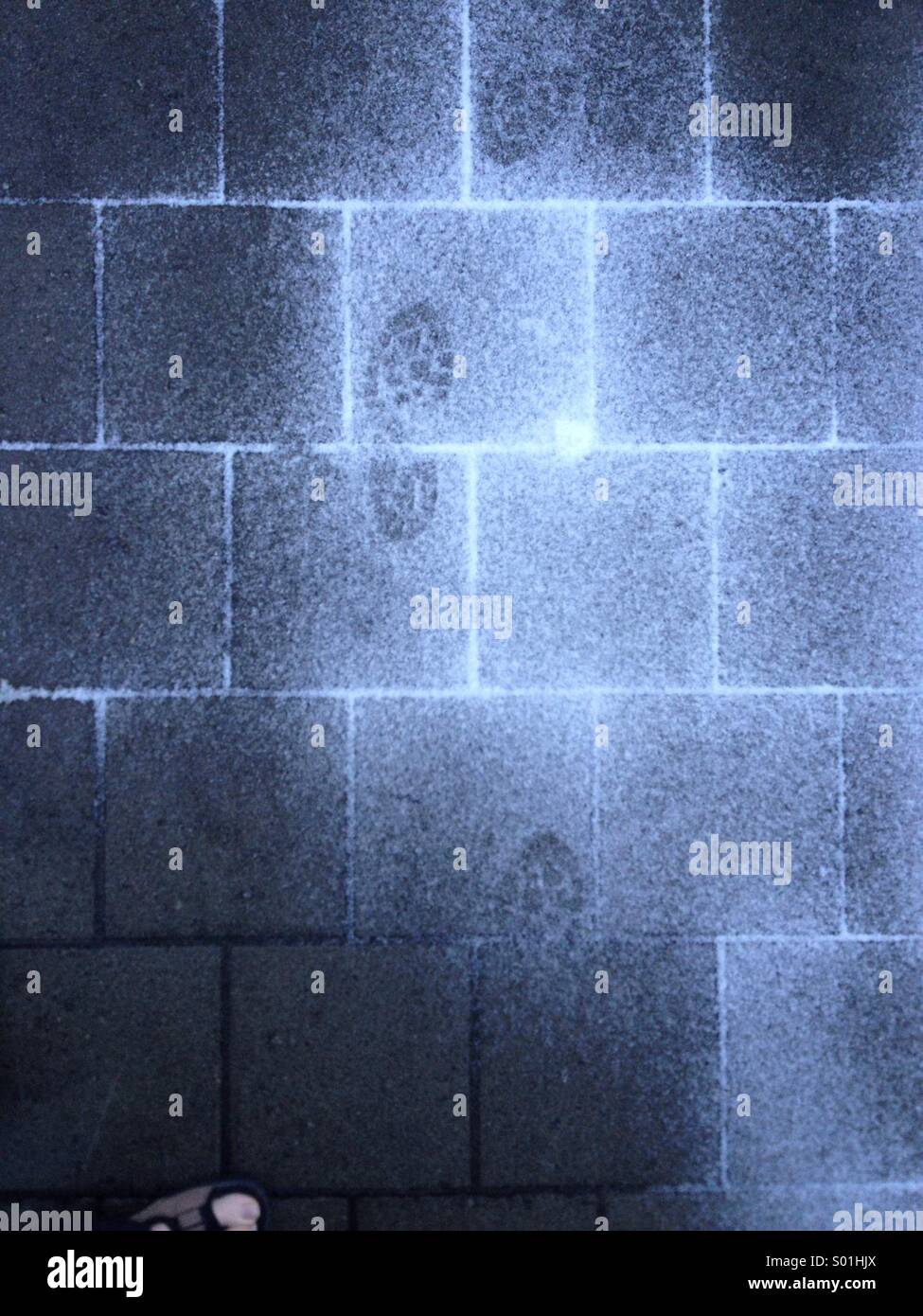 Two steps in snow Stock Photo - Alamy