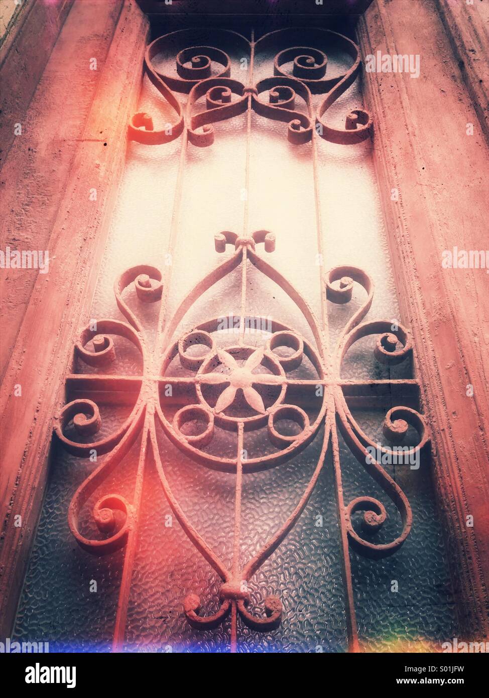 Window and wrought iron grate Stock Photo - Alamy