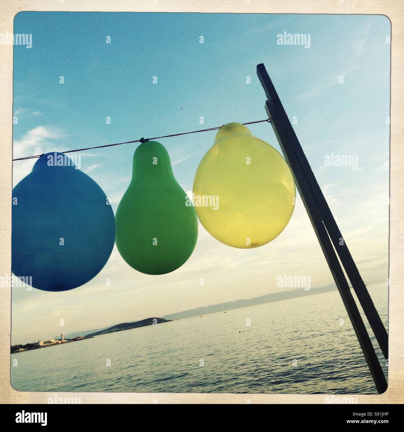 Balloons on seaside Stock Photo - Alamy