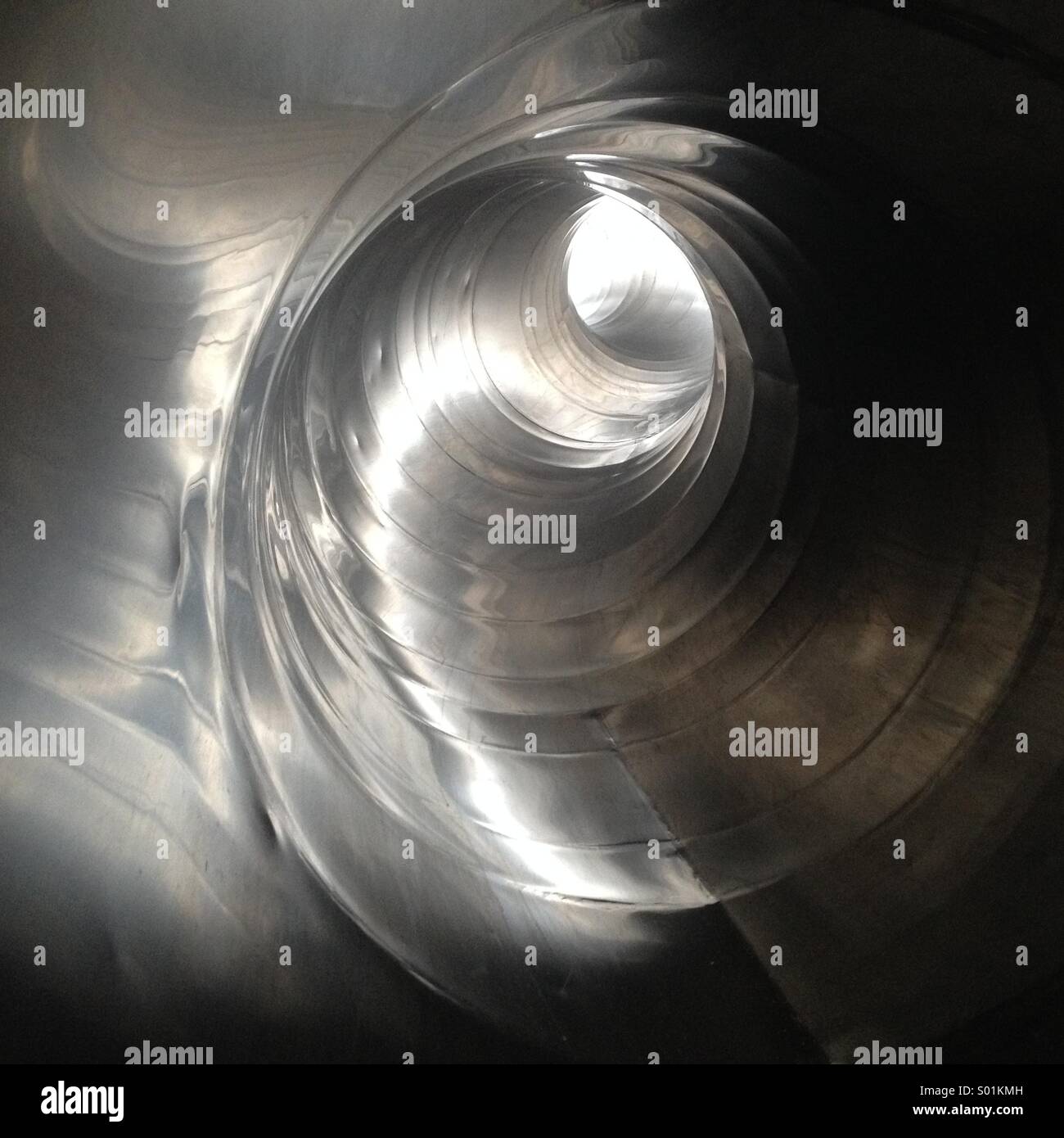 View of the interior of a tubular slide at a children's play park Stock ...